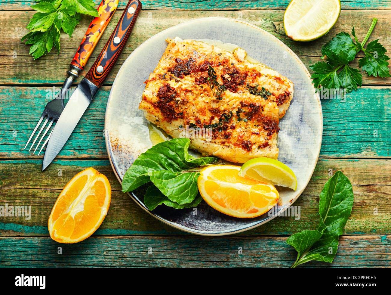 Fried fish fillets in orange oil Stock Photo - Alamy