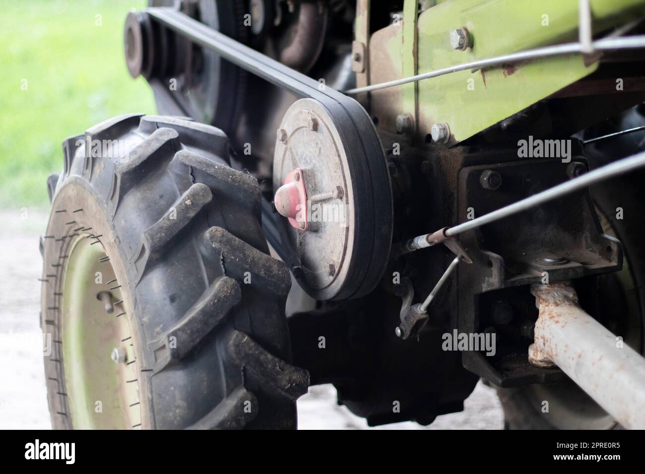 Typical heavy diesel walking tractor with trailer. Agricultural ...