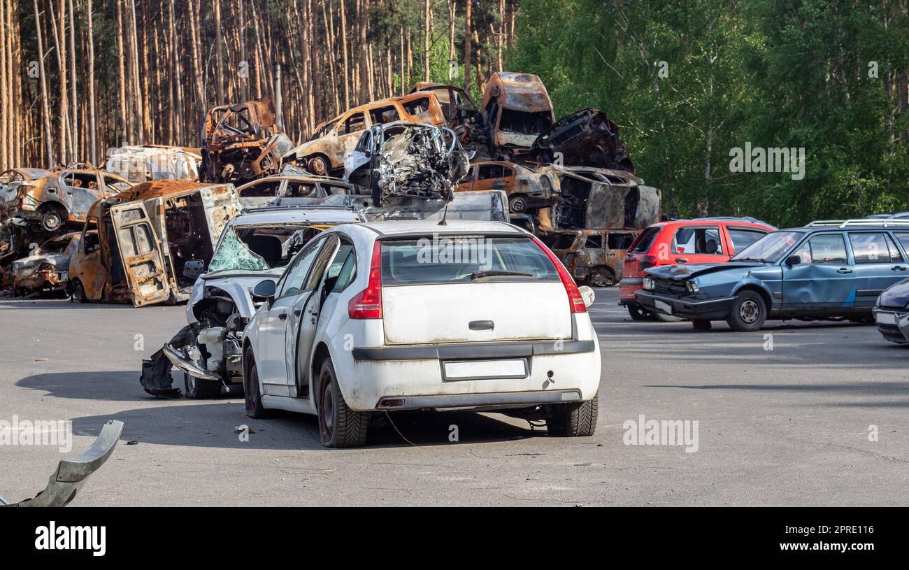 Shot, damaged cars during the war in Ukraine. The civilian car was ...