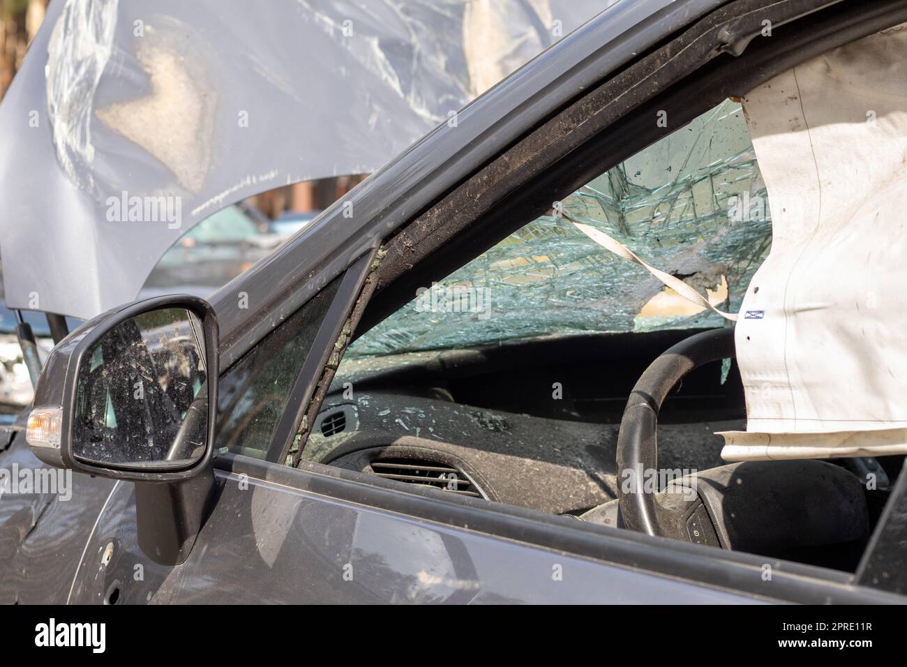 Shot car during the war in Ukraine. A car after an accident with a ...