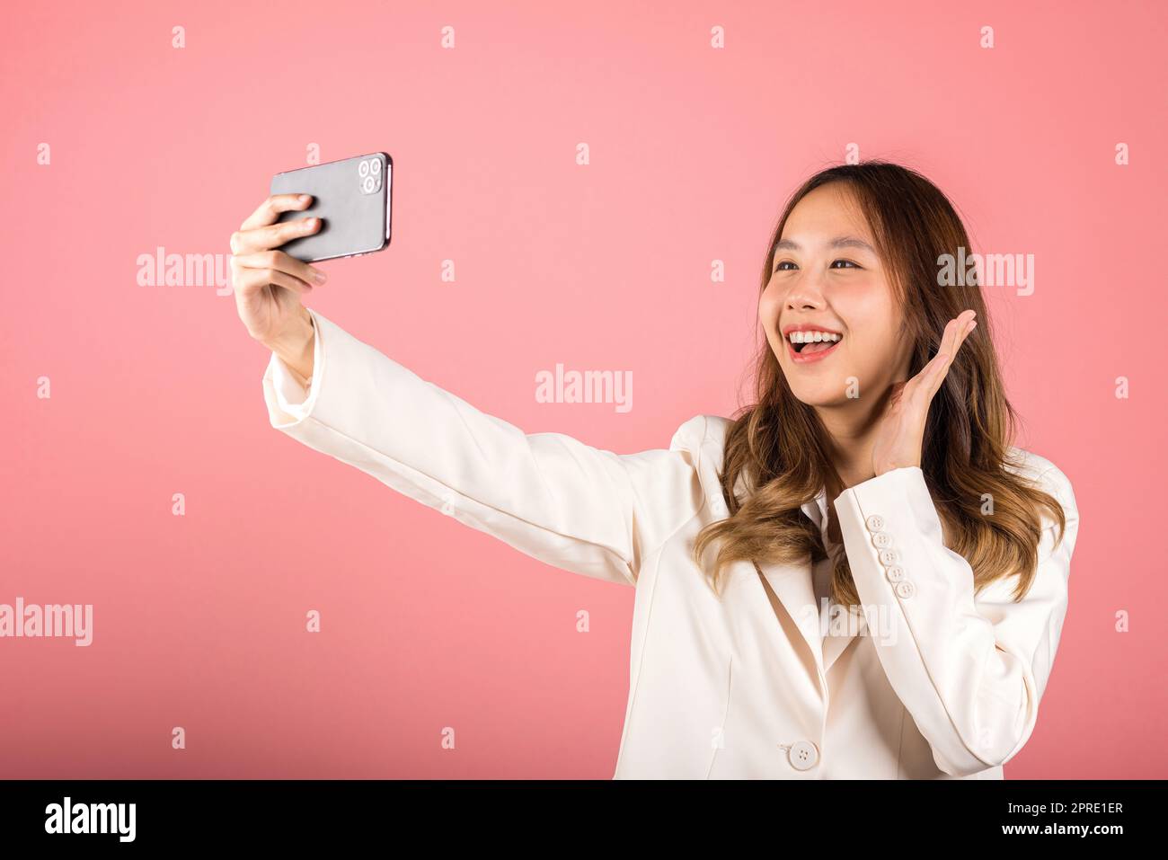 young woman smiling excited making selfie photo Stock Photo - Alamy