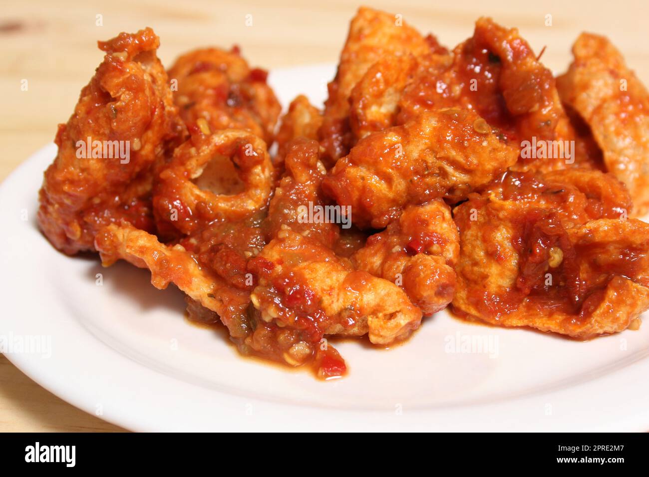 Fried Pork Skins With Red Salsa in Rustic Kitchen Stock Photo - Alamy