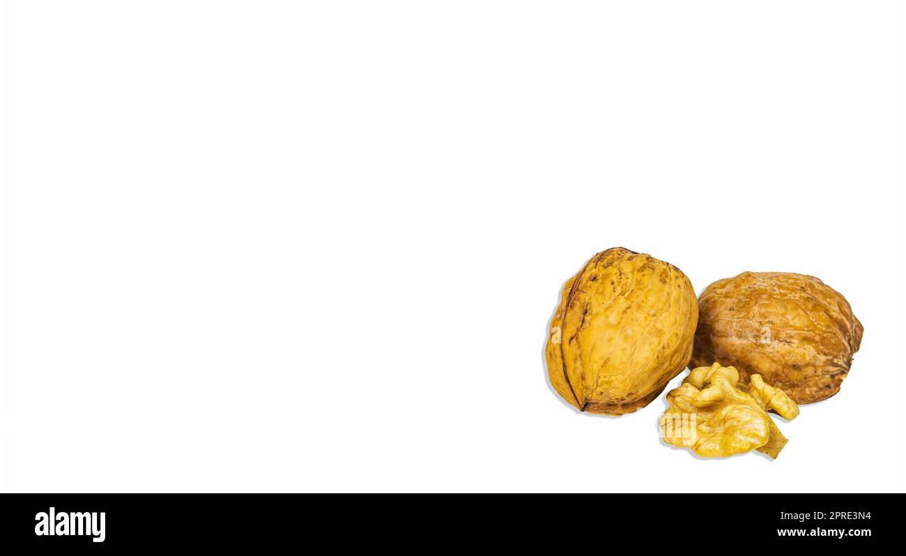Two halves of a split walnut isolated on a white background Stock Photo ...