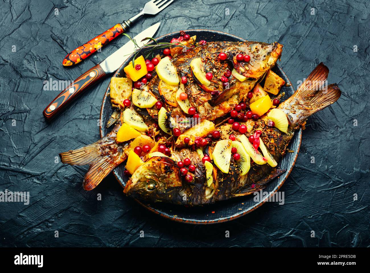 Yummy fried whole fish in fruit marinade Stock Photo - Alamy