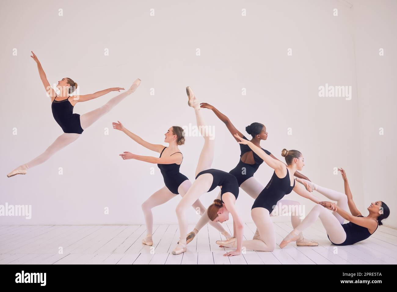 Group of contemporary or ballet dancers performing a unique sequence in ...