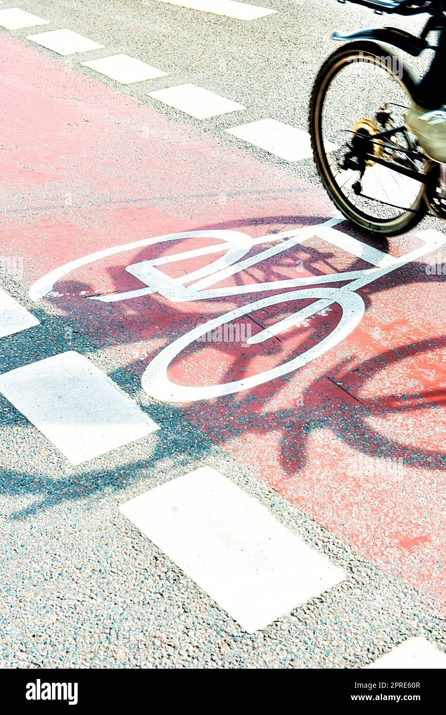 Cycle path, bicycle symbol as a lane marking or road marking on a road ...