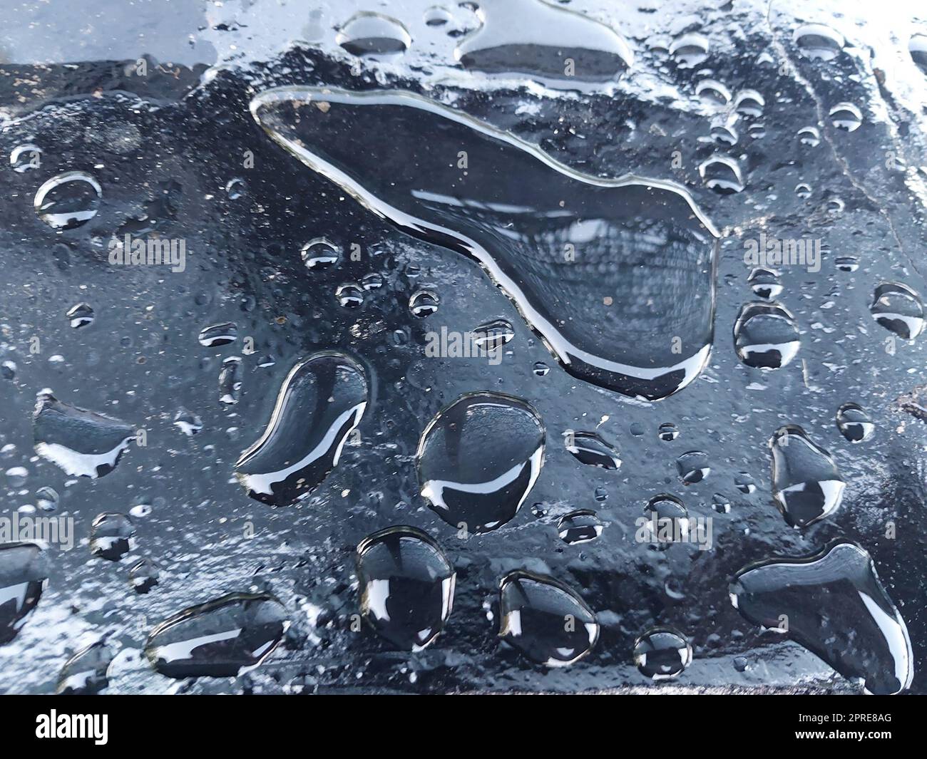 Spraying liquid bituminous mastic on the concrete foundation for the ...