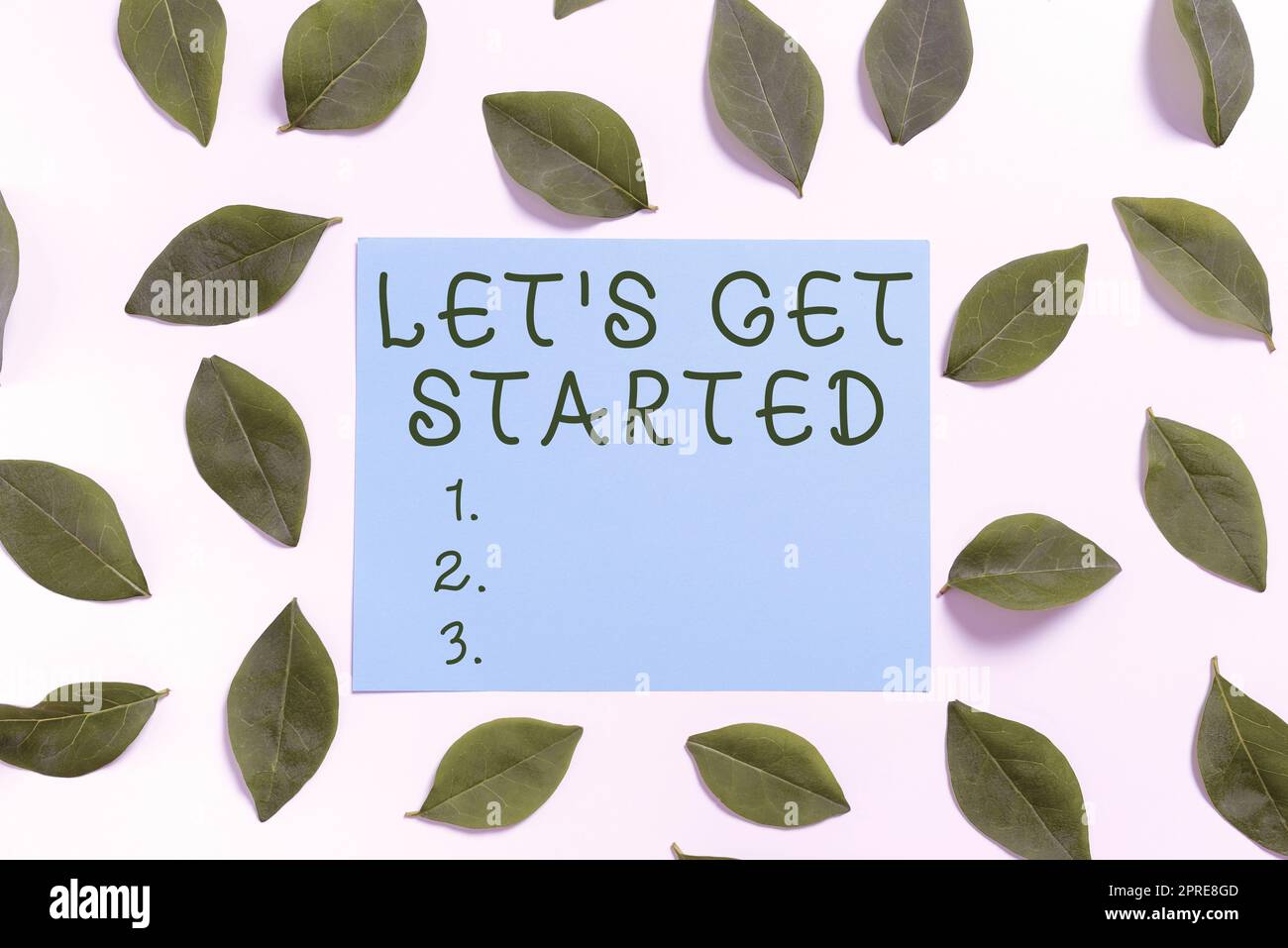 Hand writing sign Let s is Get StartedTo begin doing or working on ...