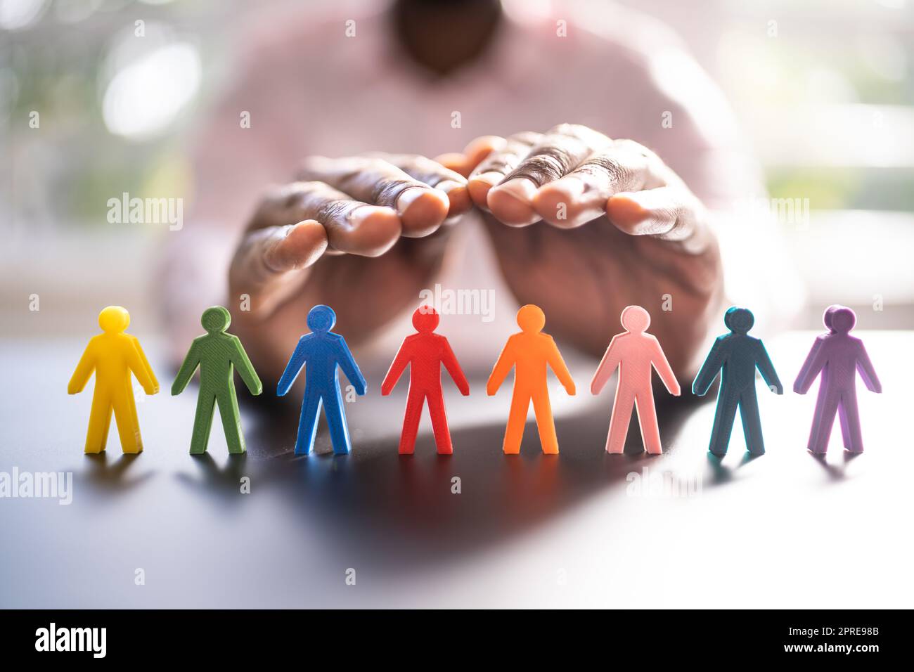 Inclusion And Diversity. Hand Protecting Inclusive Equal Pawns Stock ...