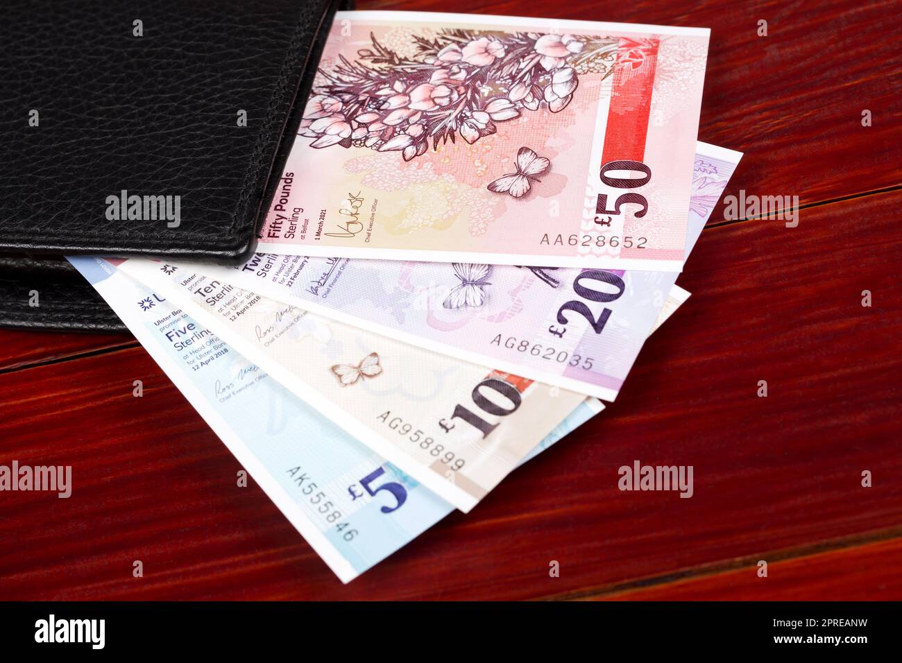 Northern Ireland’s money - Pounds in the black wallet Stock Photo - Alamy