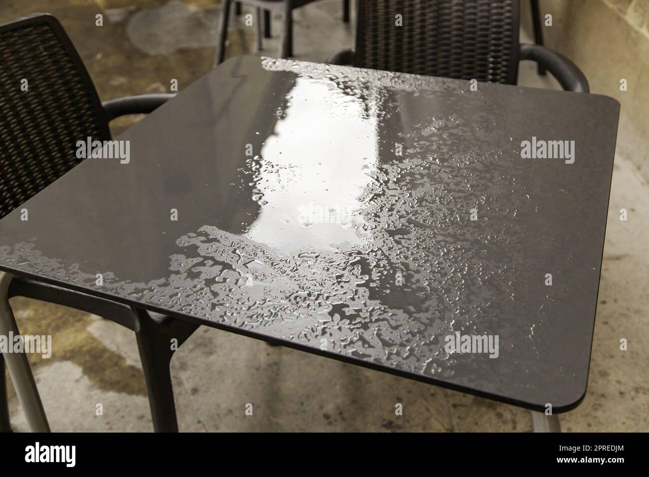 Detail of an outdoor table on a rainy day Stock Photo - Alamy