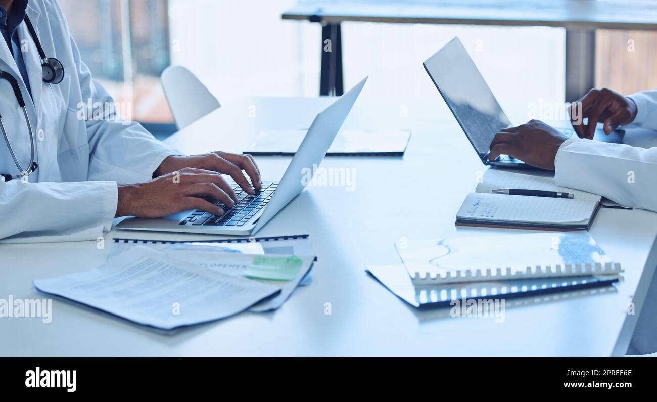 Medical, laptop and hands of doctors team work on hospital clinic ...