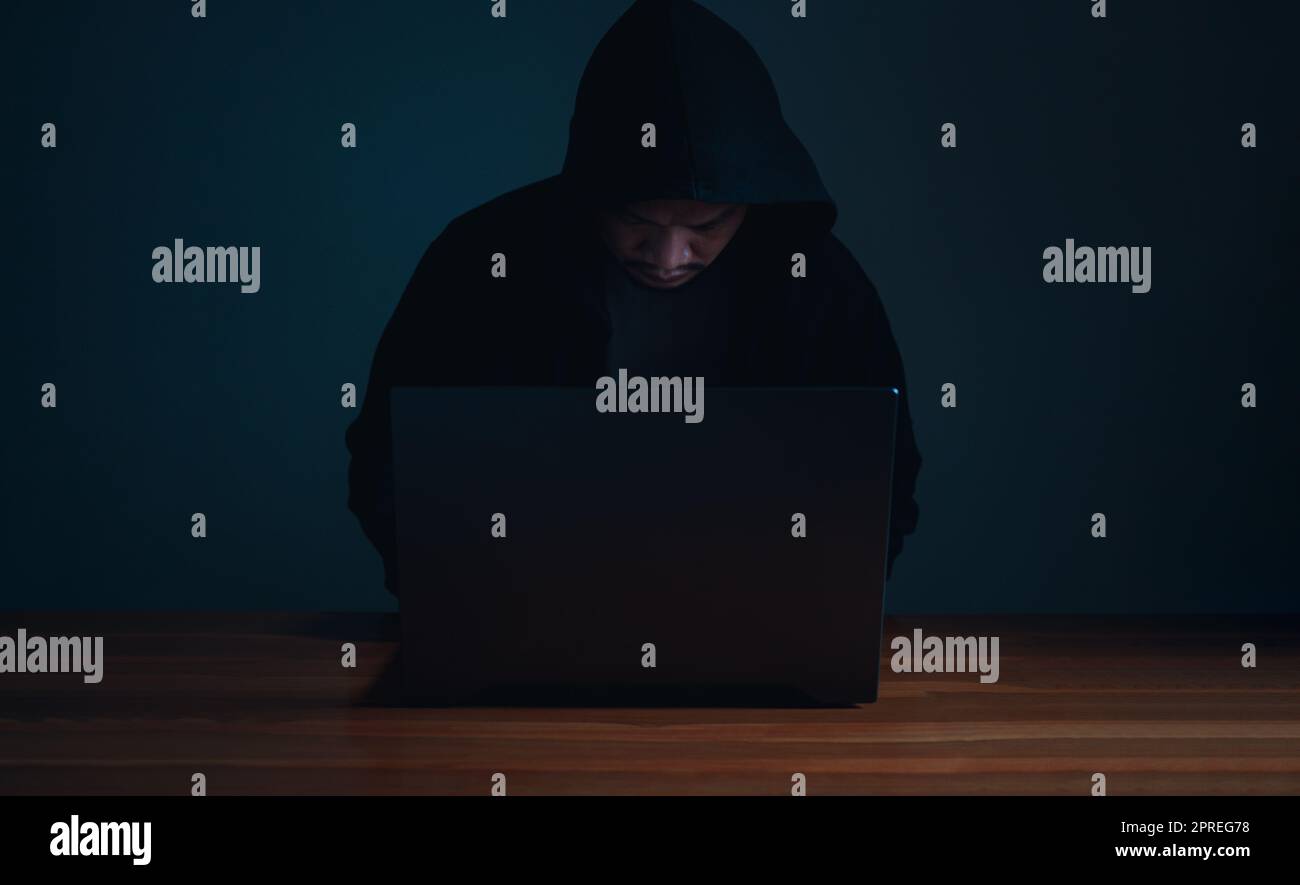 Hackers work on laptops in the dark. The concept of information ...