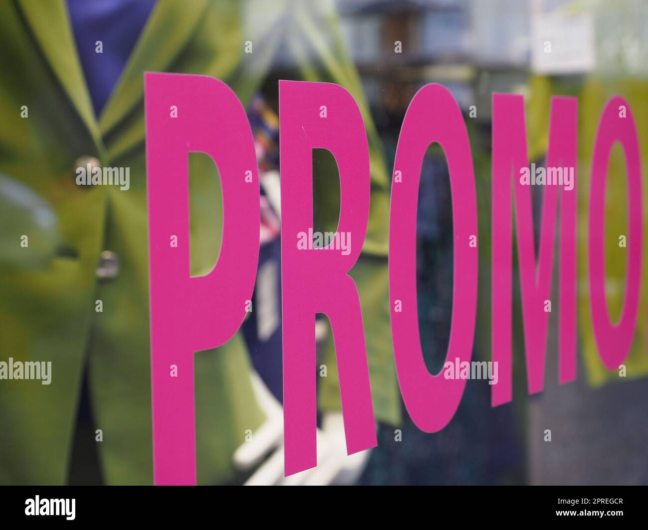 pink promo sign in a shop window Stock Photo - Alamy