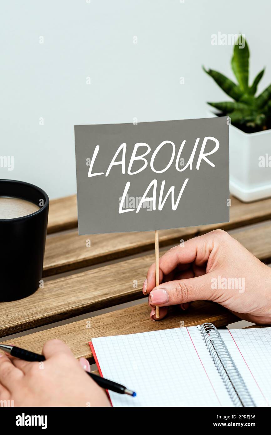 Hand writing sign Labour Law, Business showcase Rules implemented by ...