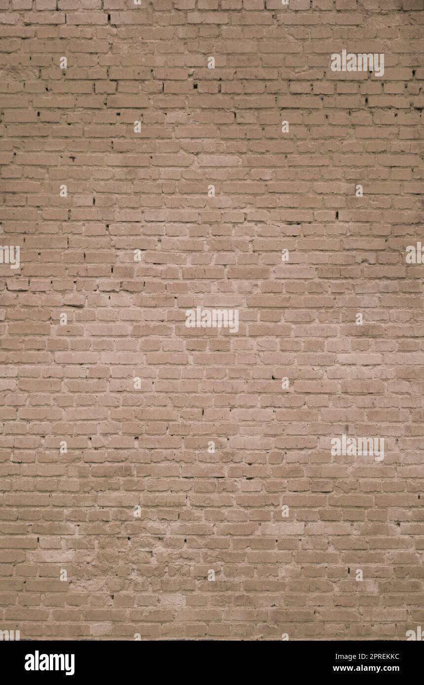 The texture of the brick wall of many rows of bricks painted in brown ...