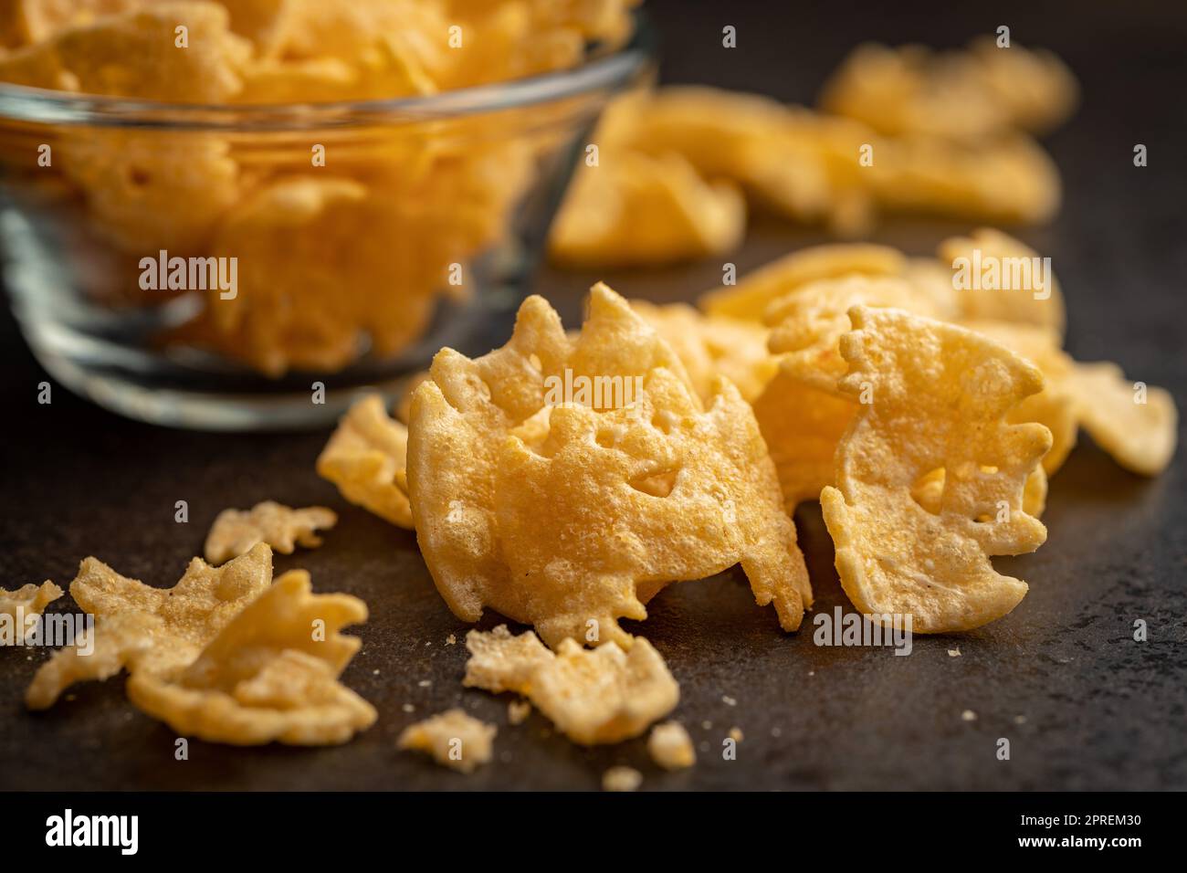 Halloween crispy bat shaped chips on the dark table Stock Photo - Alamy