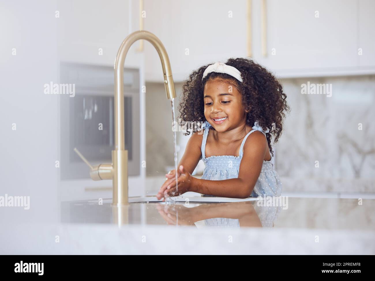 Little girl, washing and hands with smile in the kitchen for healthy ...