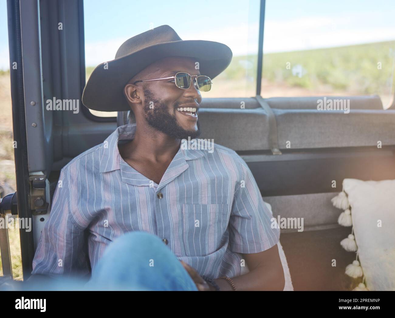 Comic, happy and black man on a road trip in van during holiday on the ...