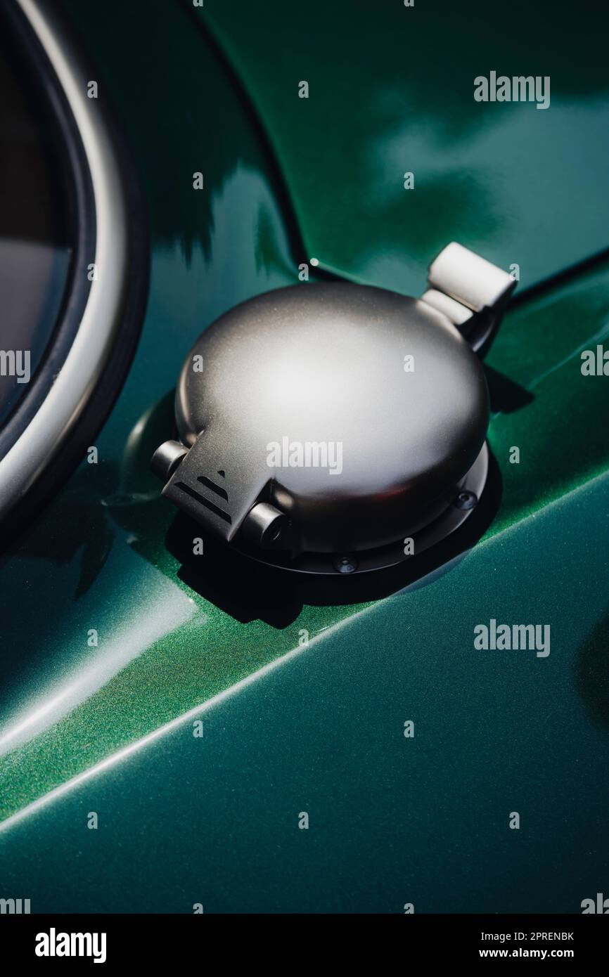 Fuel tank cap with key slot on white vintage car or bus Stock Photo - Alamy