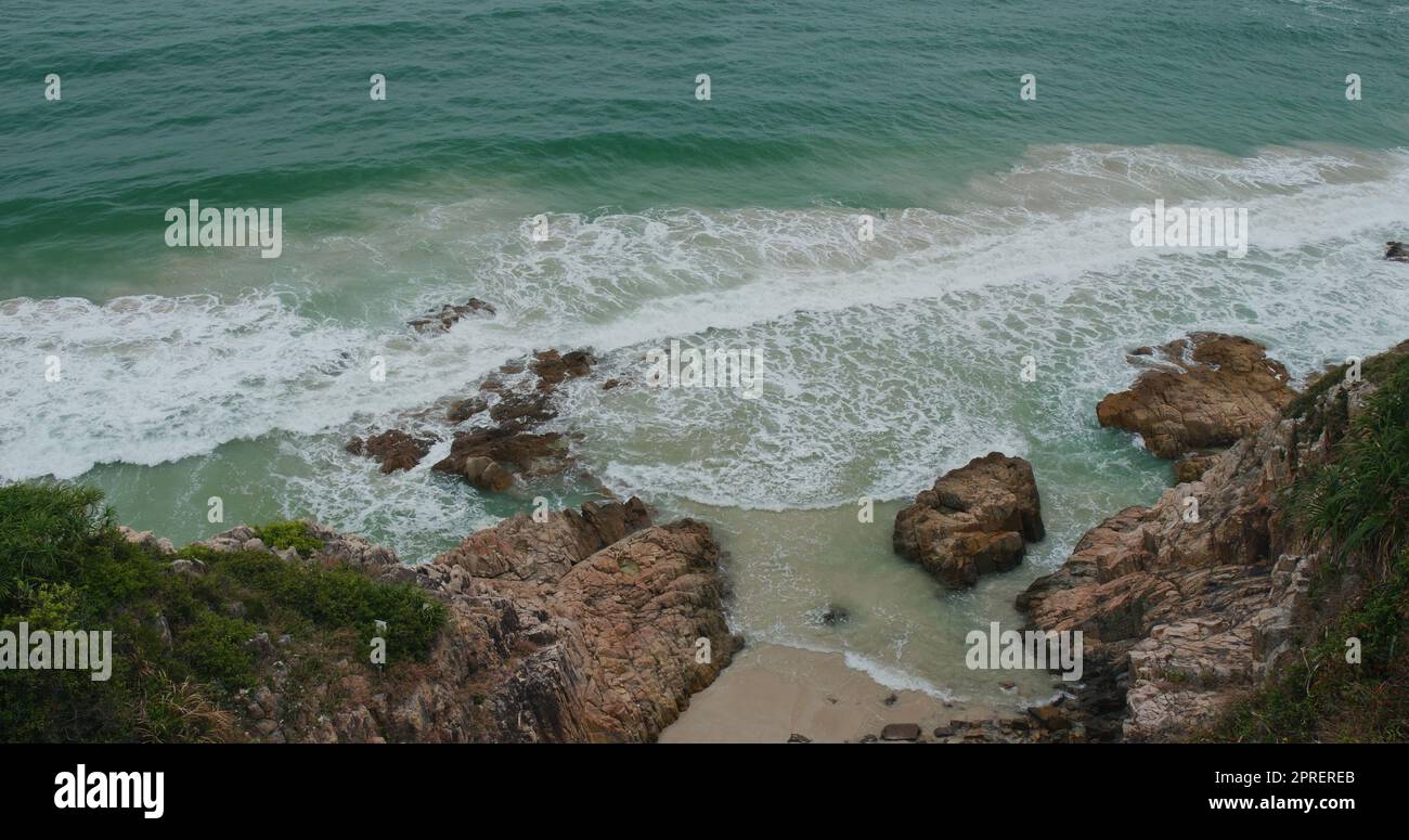 Sea wave splash on the rock Stock Photo - Alamy