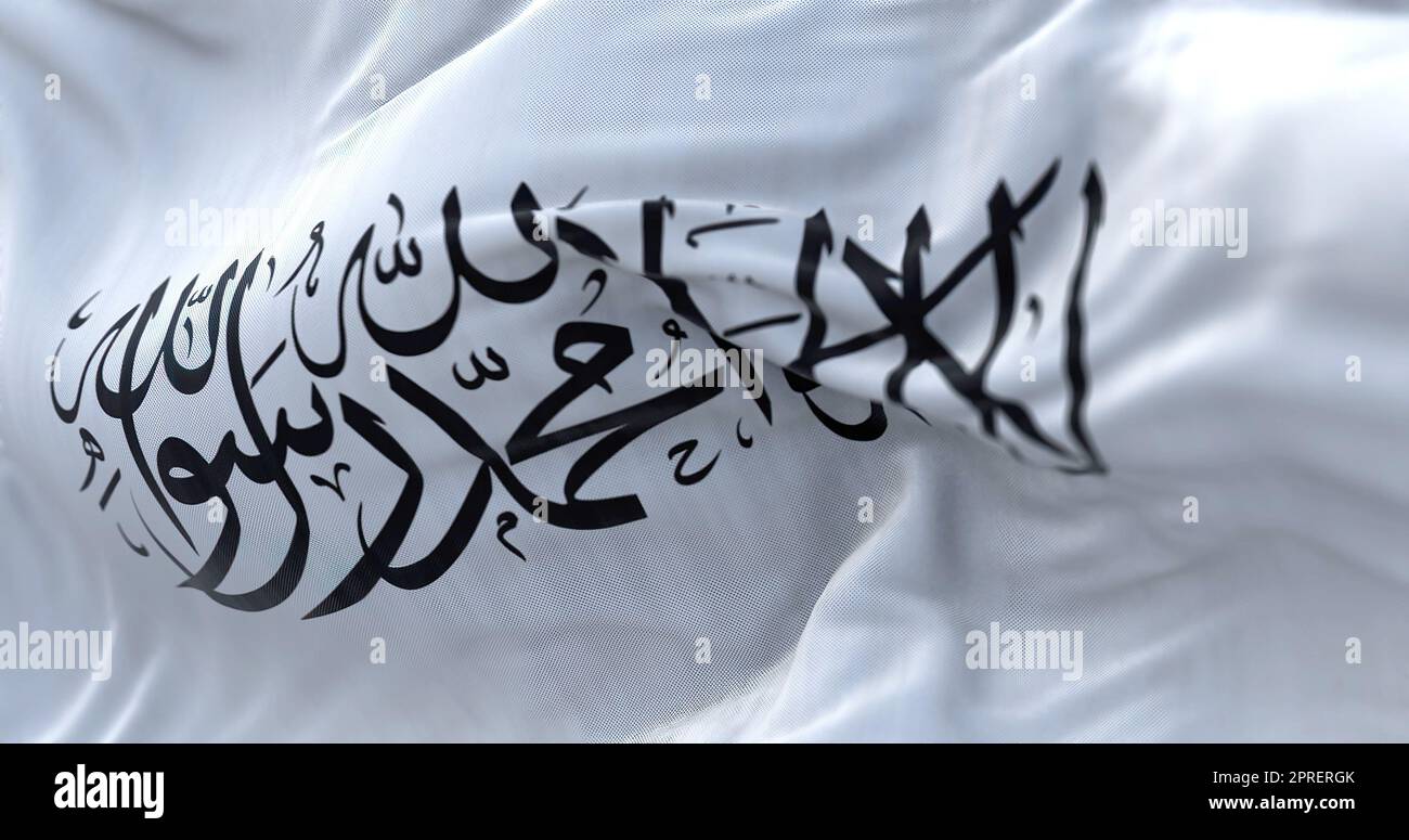 The flag of the Islamic Emirate of Afghanistan waving in the wind. It is an unrecognized Islamic ...