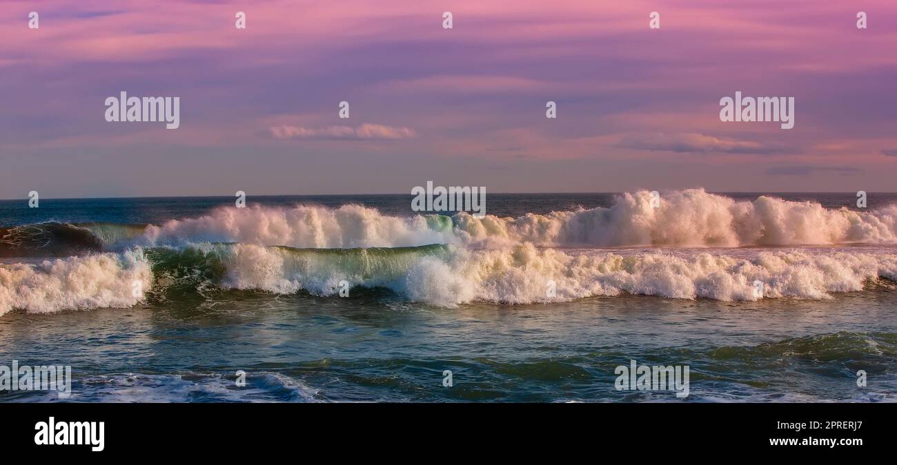 The Big beautiful waves in the ocean at sunset Stock Photo - Alamy