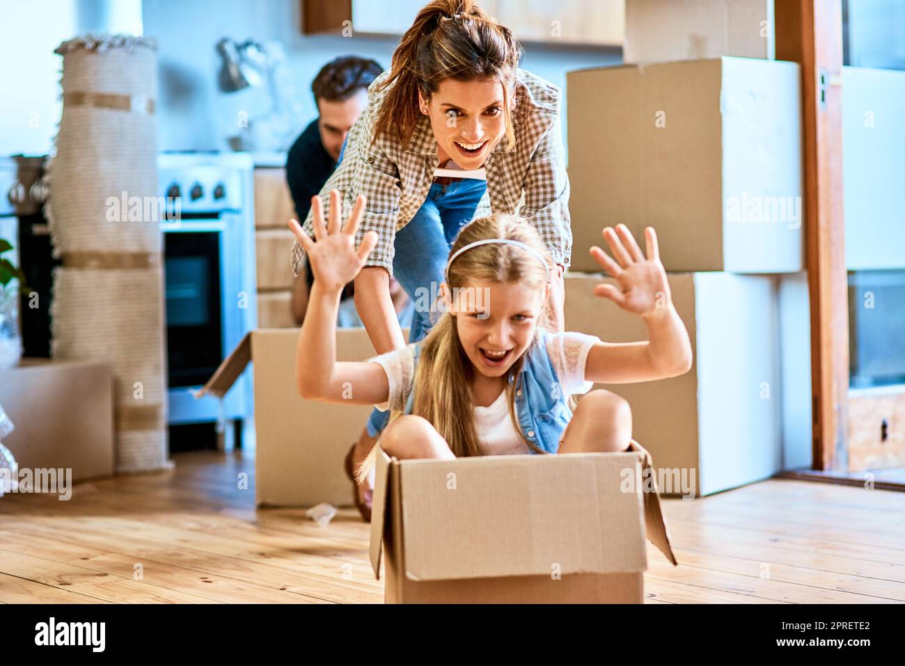 Time to go on an adventure. a cheerful young woman pushing her daughter ...