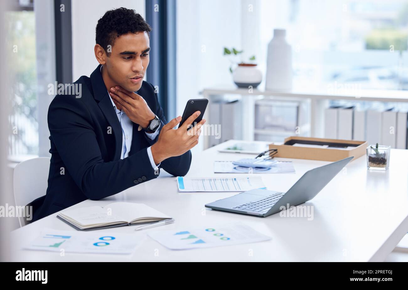 Making a video call to a colleague. a young businessman using a ...