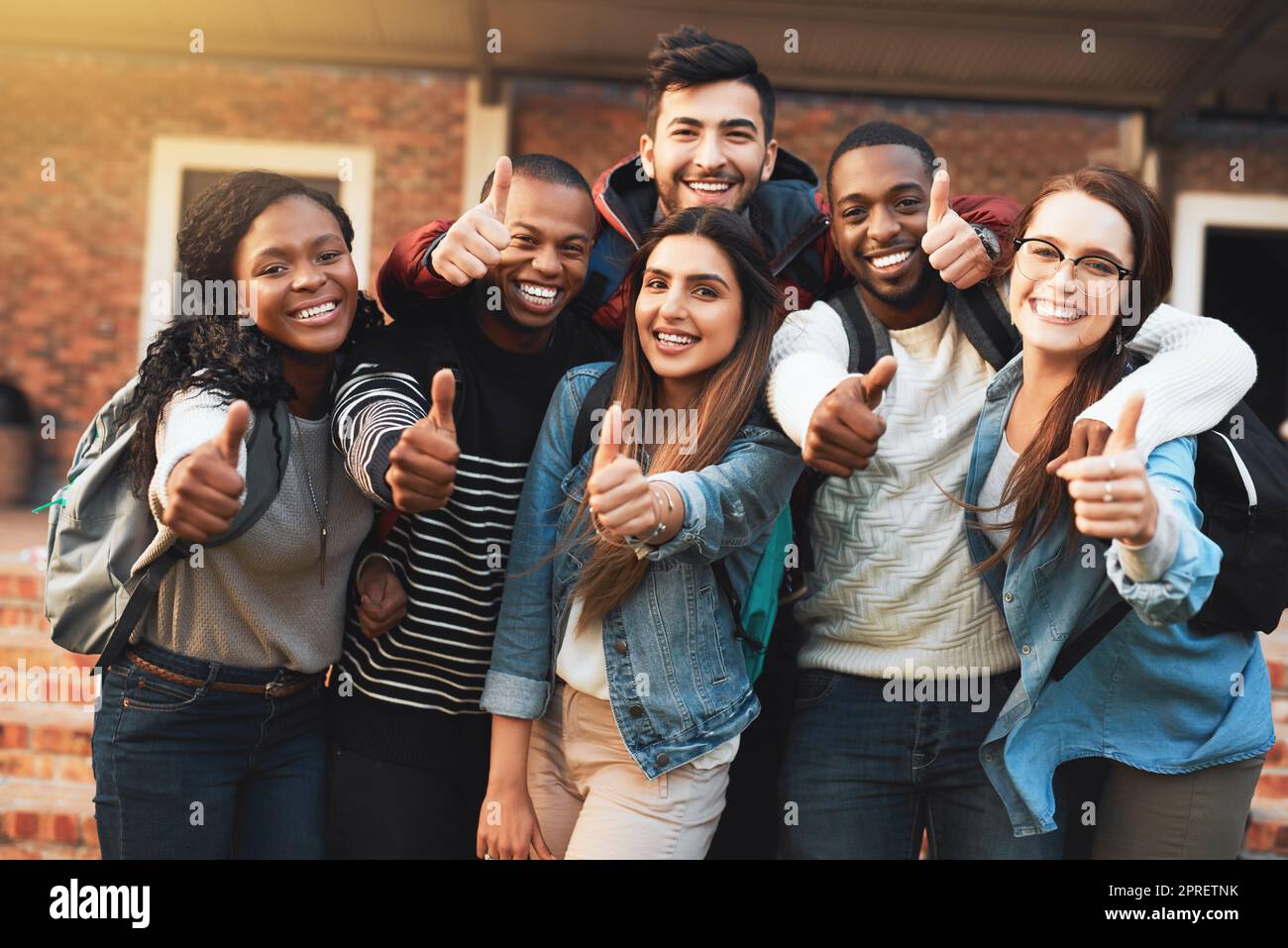 We give college life an A. Portrait of a group of students giving ...