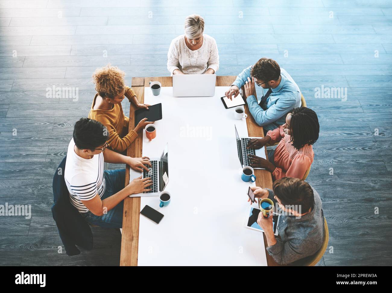Group typing on laptops in office hi-res stock photography and images ...