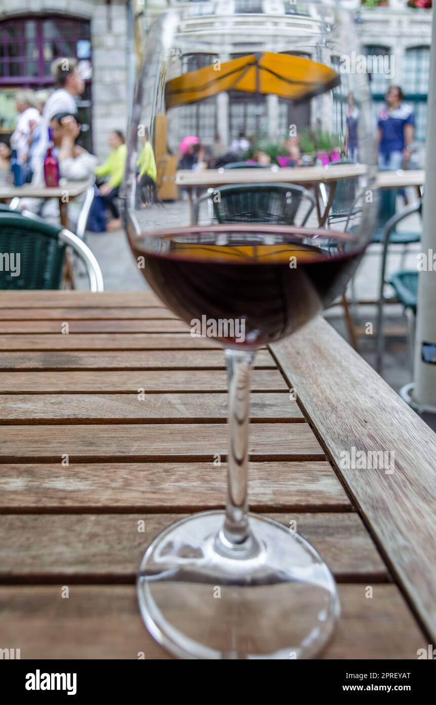 View through a glass of red wine Stock Photo - Alamy