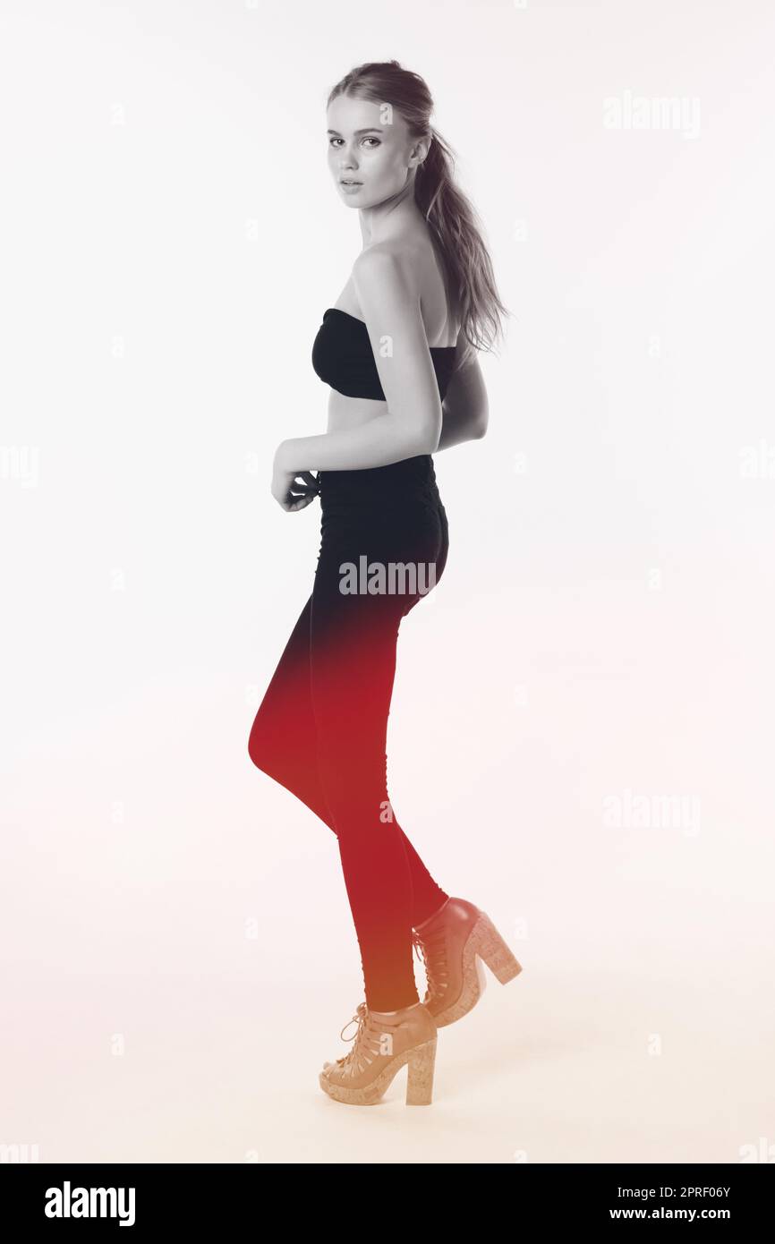 Standing tall and stylish. Full length shot of a gorgeous young woman ...