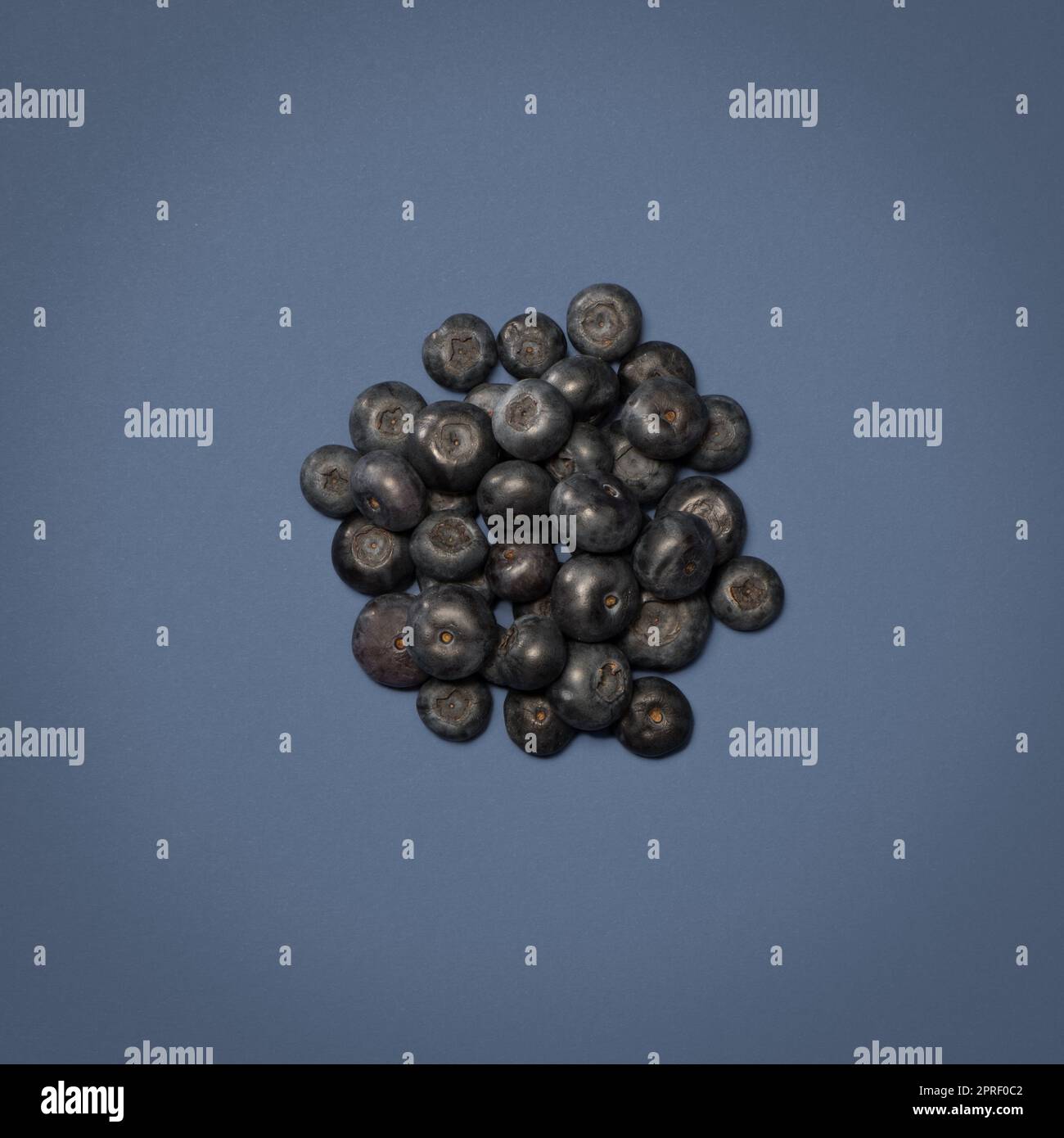 Great for skin hair and nails. blueberries against a studio background ...