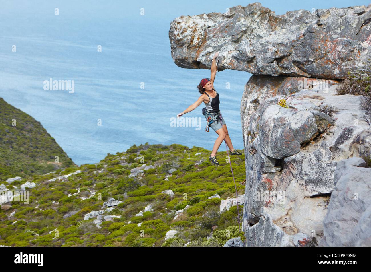 Ill go to any lengths for the perfect view. A beautiful young woman ...