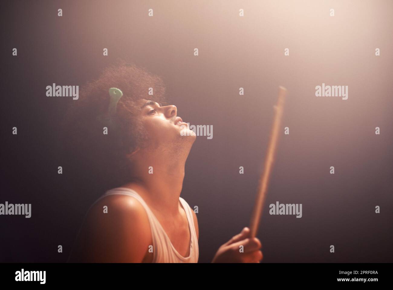 Smacking the skins hard. A young drummer rocking out on stage Stock ...