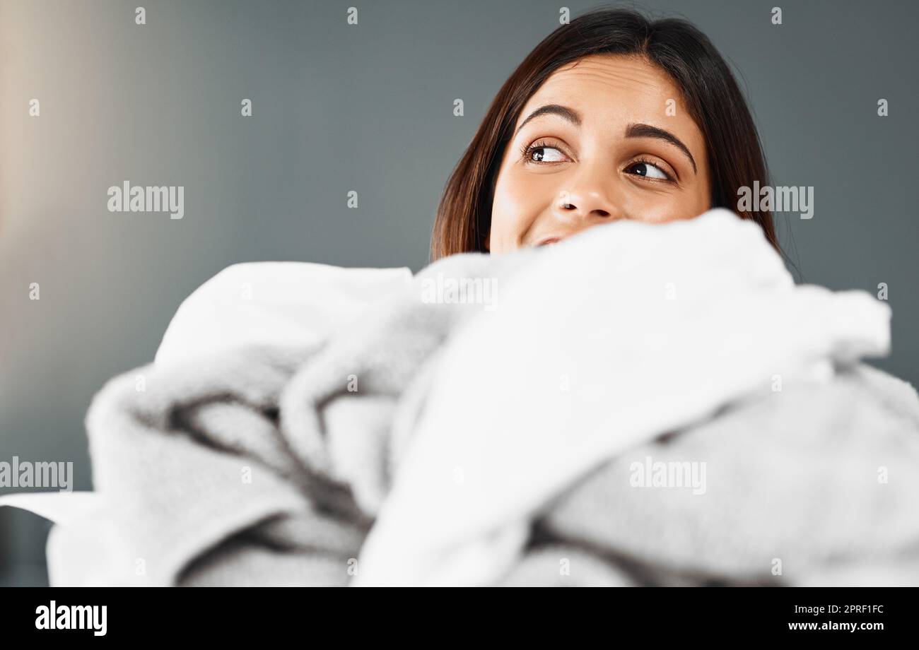 Determined not to let the laundry pile up. an attractive young woman ...