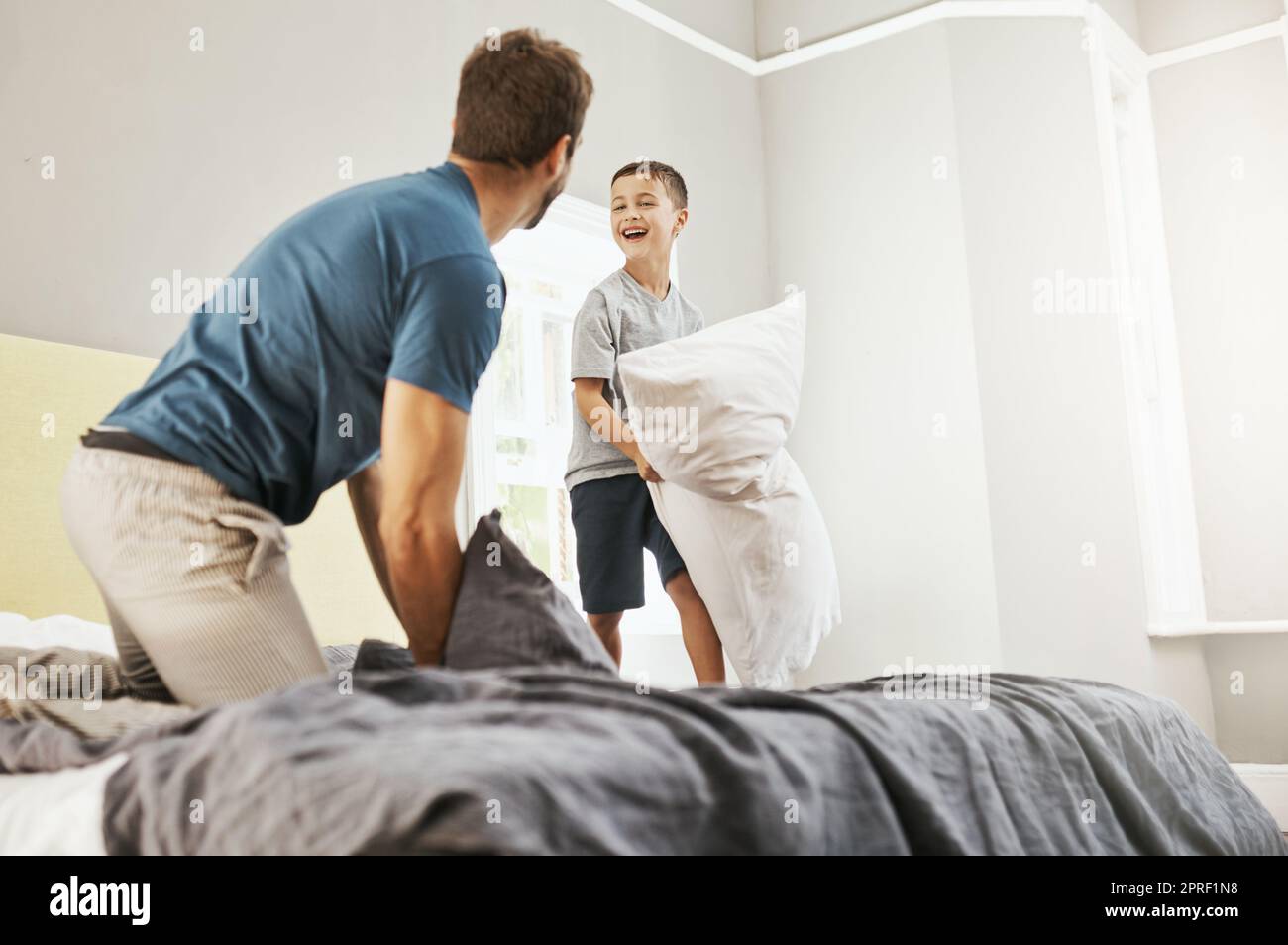 Boy making bed hi-res stock photography and images - Alamy