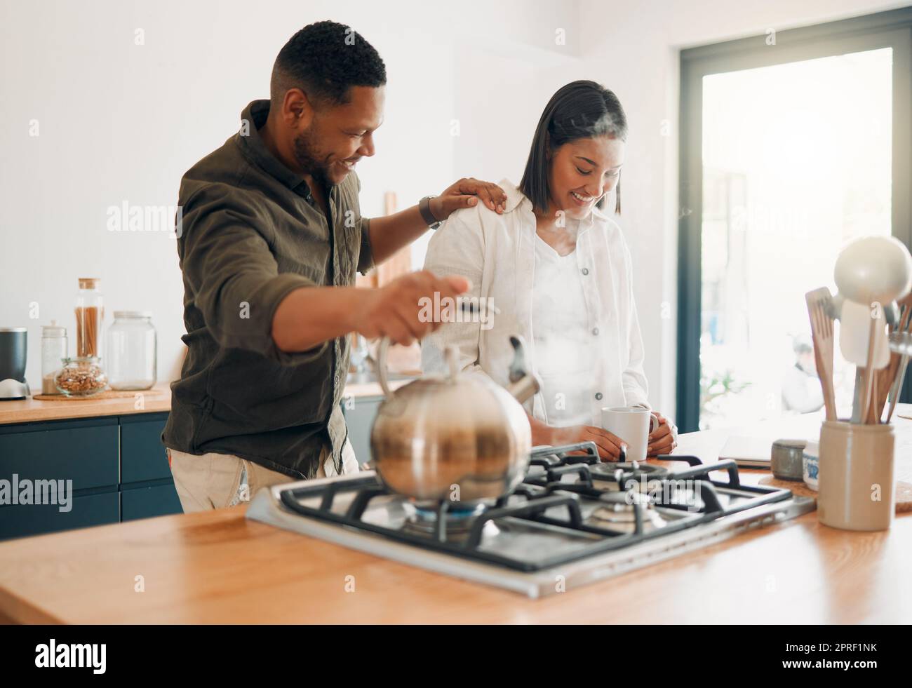 Latino couple talking kitchen hi-res stock photography and images - Alamy