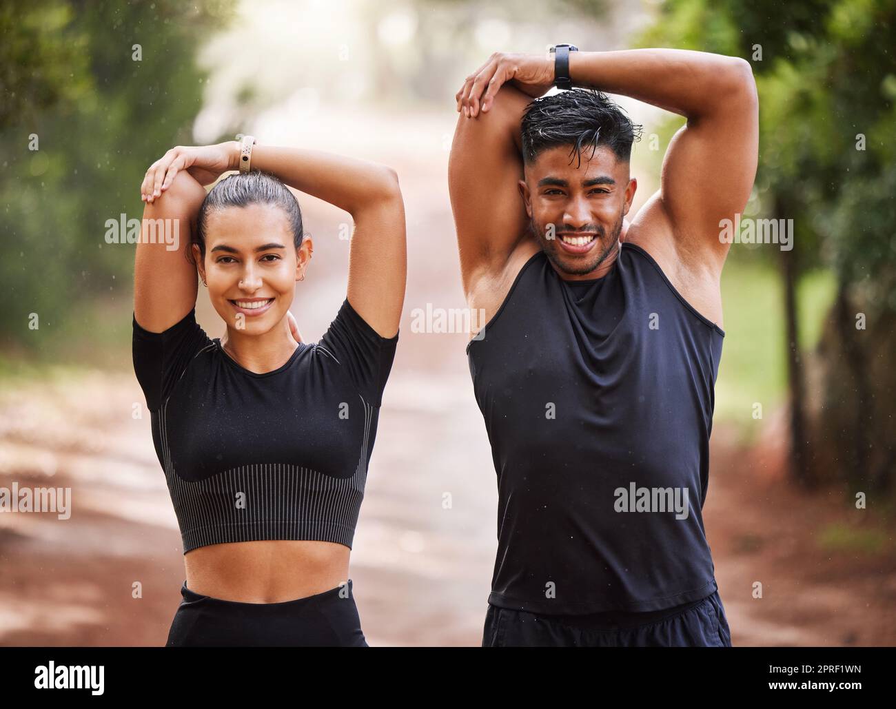Fit couple or active, athlete friends stretching arms for exercise ...
