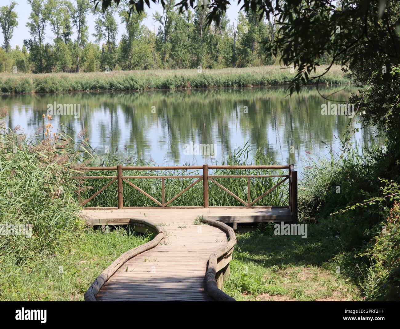 wooden path bound for the river safe walk Stock Photo - Alamy