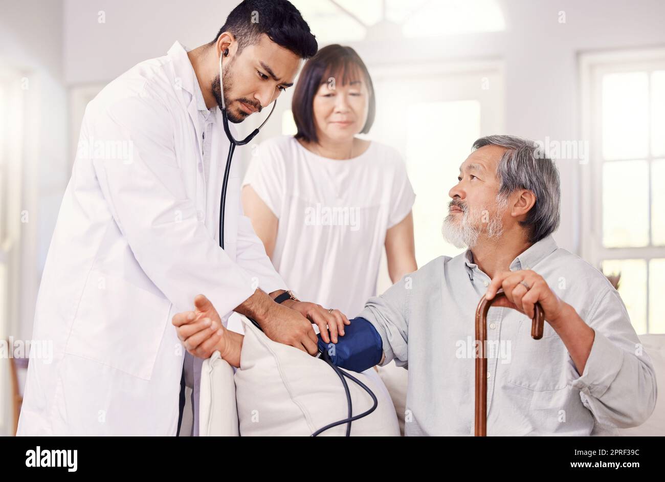 Doctor patient asian senior couple hi-res stock photography and images ...