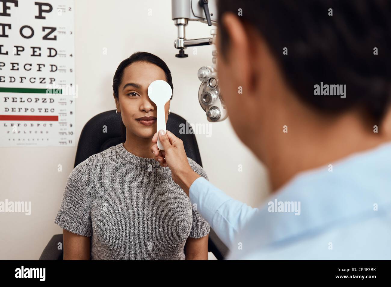 Young woman before eye test hi-res stock photography and images - Alamy