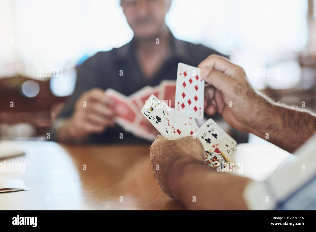 Two People Playing Cards
