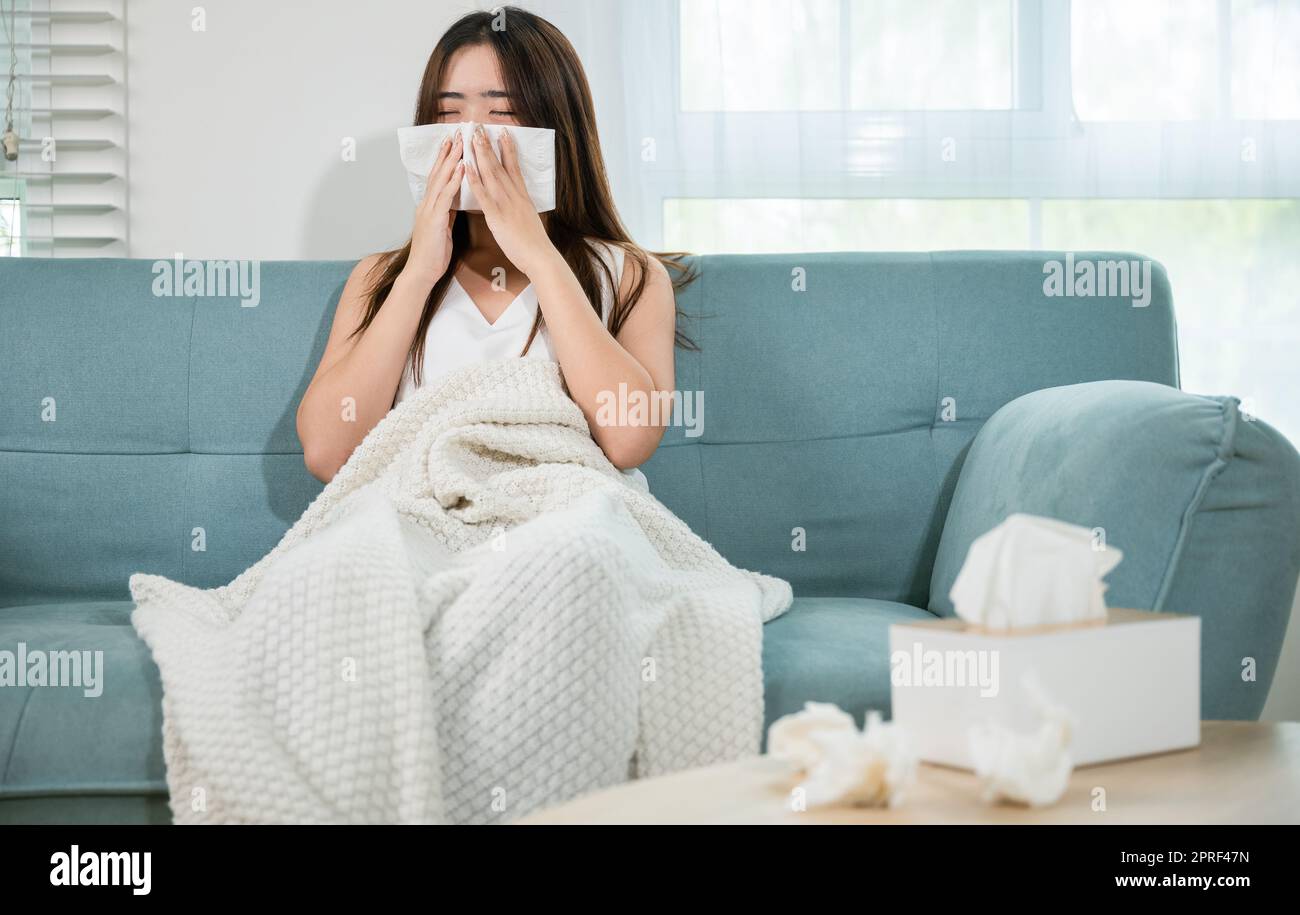 Asian woman blowing tissue hi-res stock photography and images - Alamy