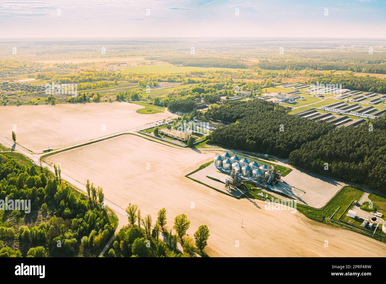 Aerial View Modern Granary, Grain-drying Complex, Commercial Grain Or Seed Silos In Sunny Spring ...
