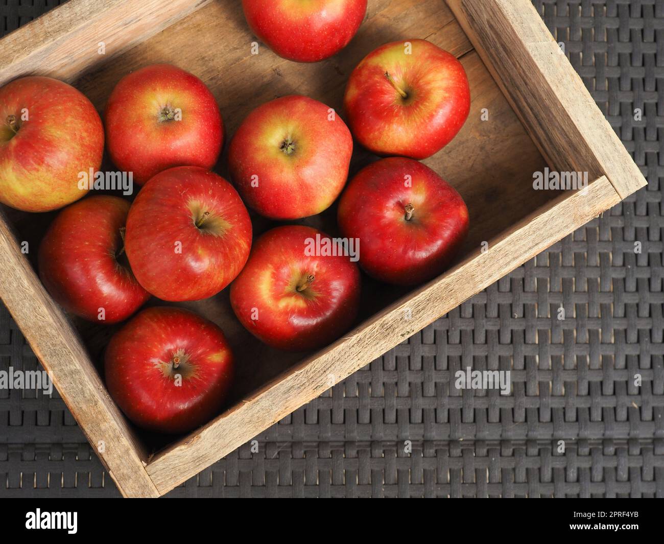 Fresh red organic apples in a wooden box after harvesting Stock Photo ...