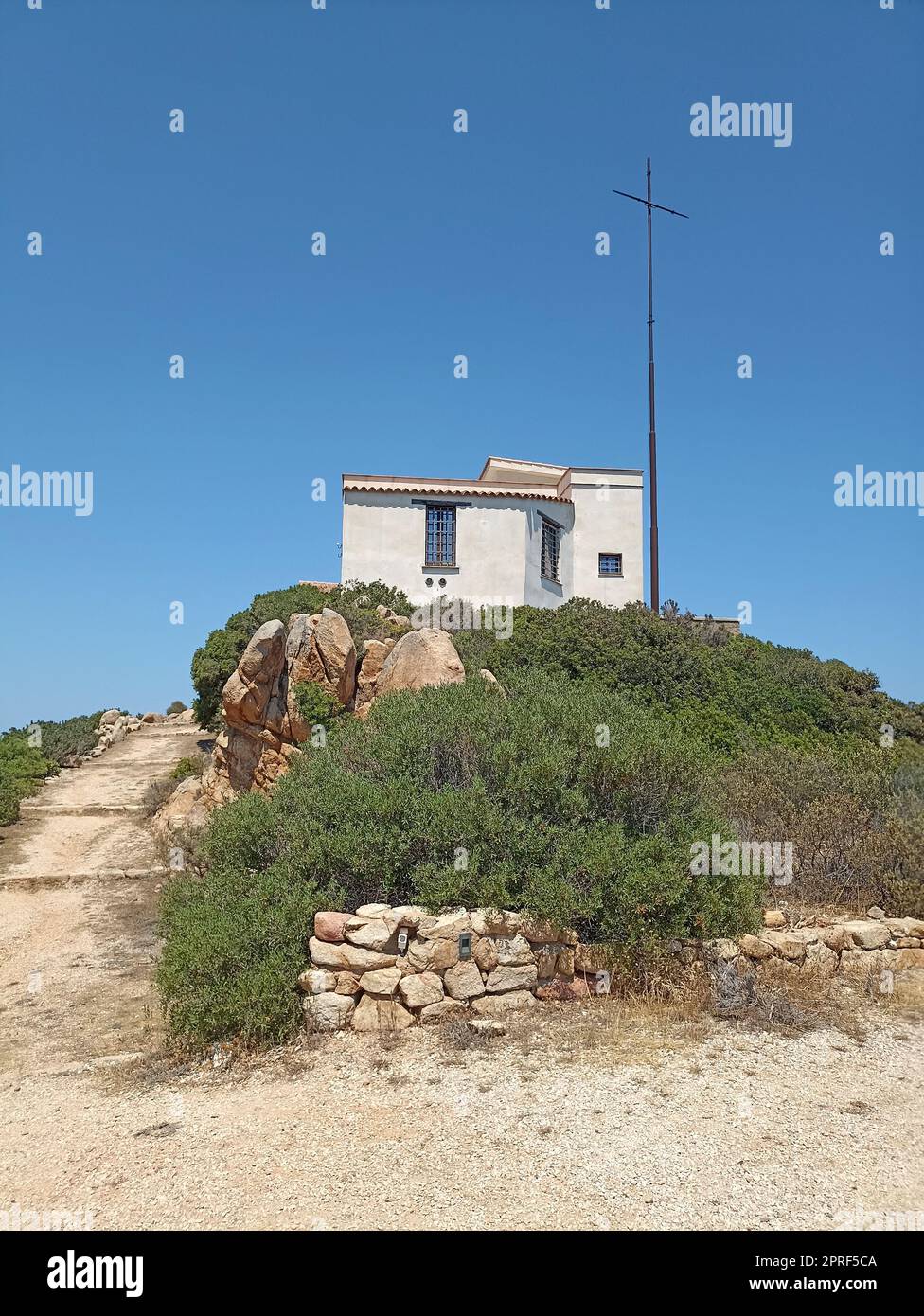 old lighthouse of Capo Comino Sardinia Stock Photo - Alamy