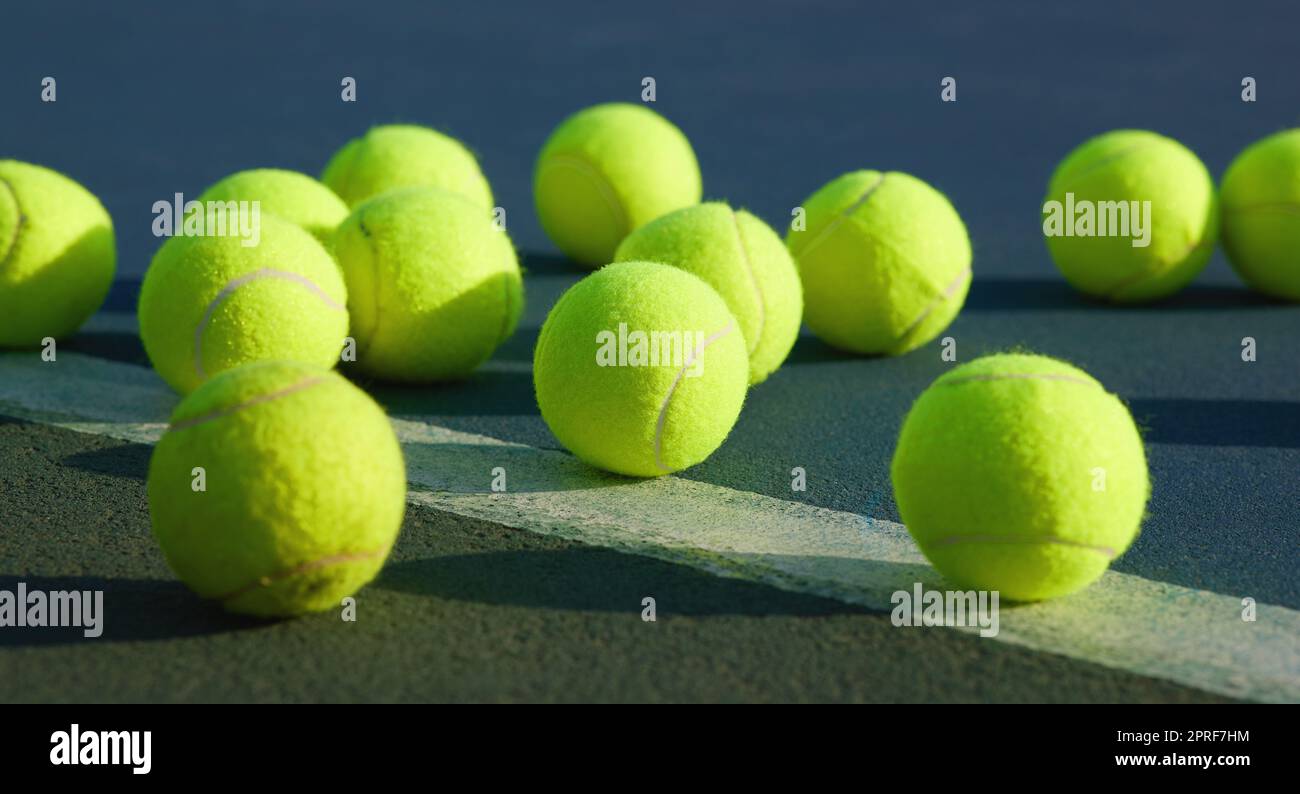 Ill bounce right back. an empty tennis court and tennis balls during ...