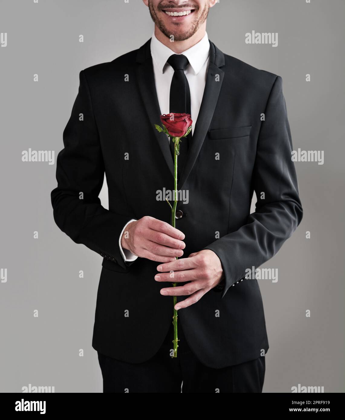 The perfect gentlemen attire. Studio shot of a well-dressed man holding ...